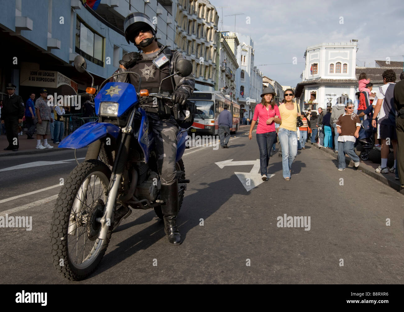 Ecuador Quito Policeman on motorcycle provides security on busy city ...