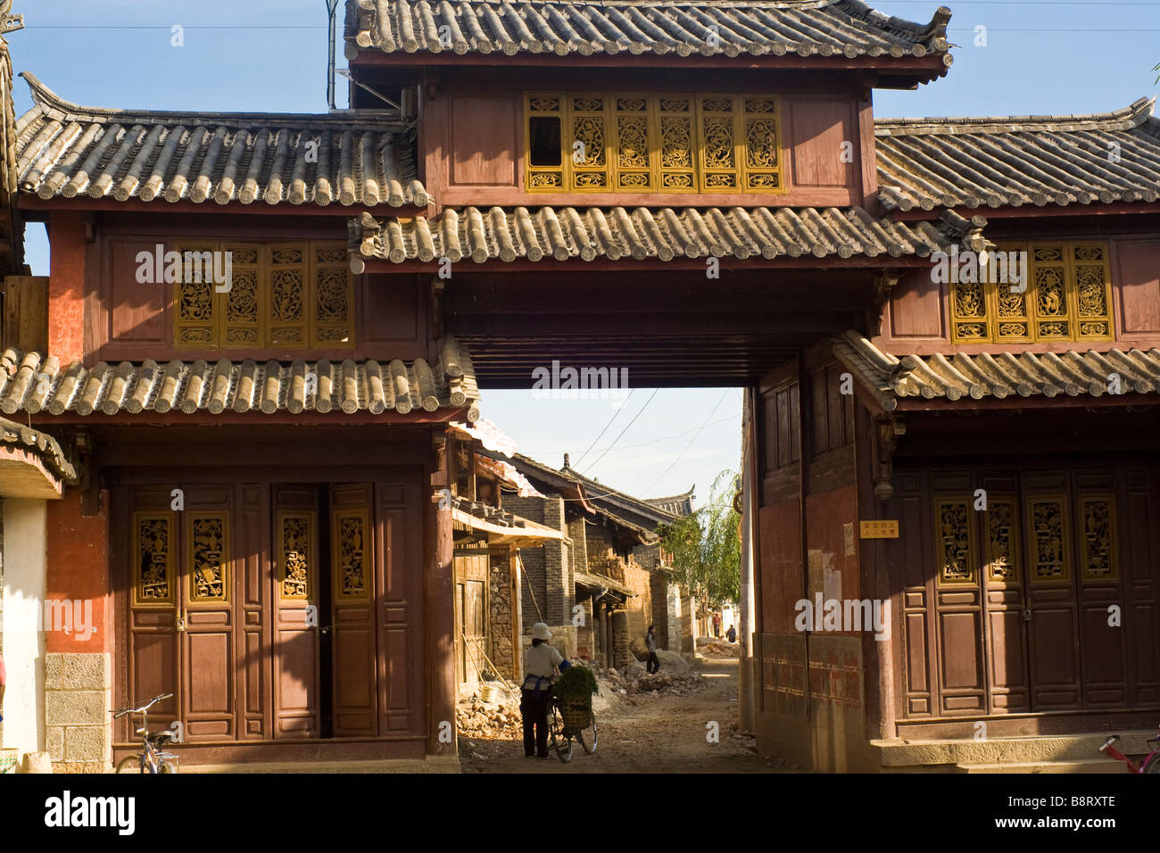 Entrance gate of the old village of Baisha, Yunnan Province, China ...