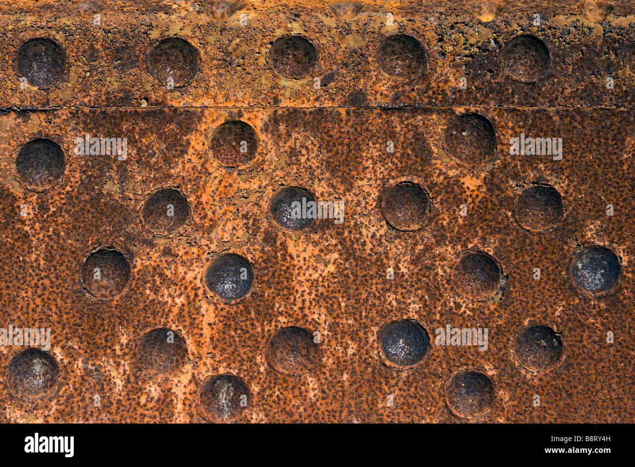 Closeup of metal bridge sheet with many rusted rivets Stock Photo - Alamy