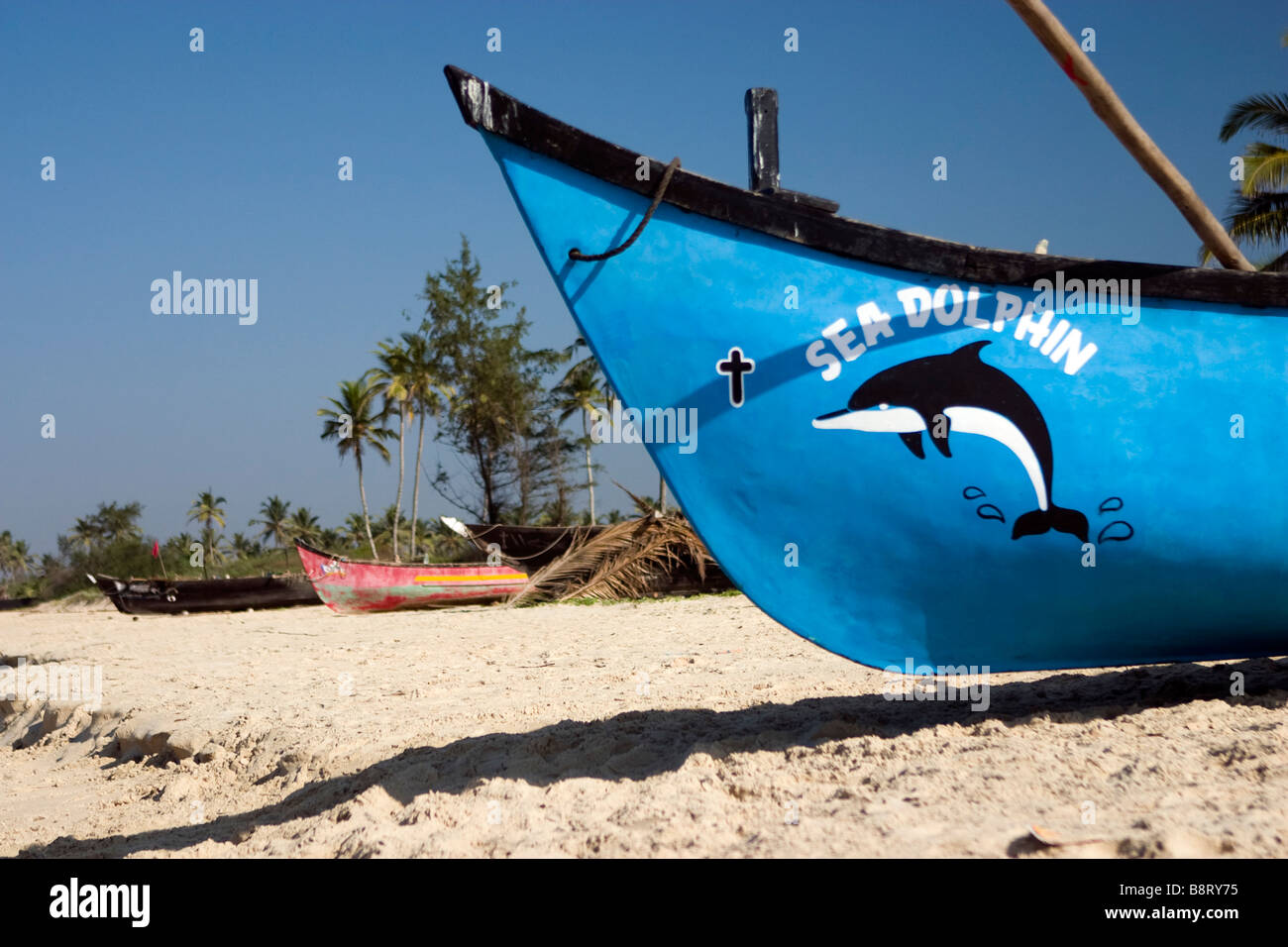 Cyan fishing boat on Varca beach ,Goa,India Stock Photo - Alamy