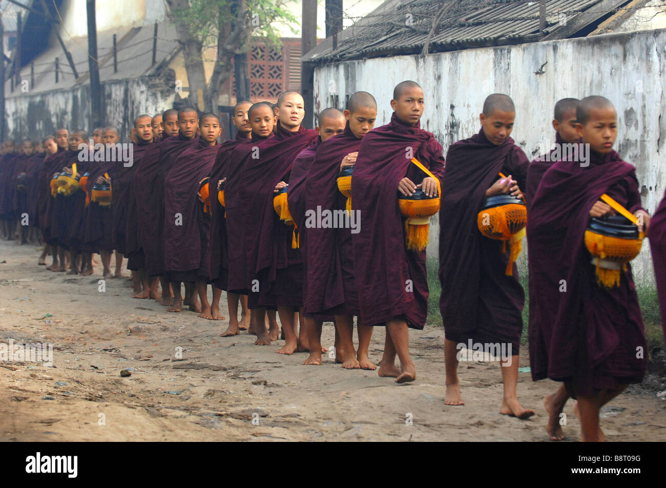 group of young monks walking one behind the other, Burma Stock Photo ...