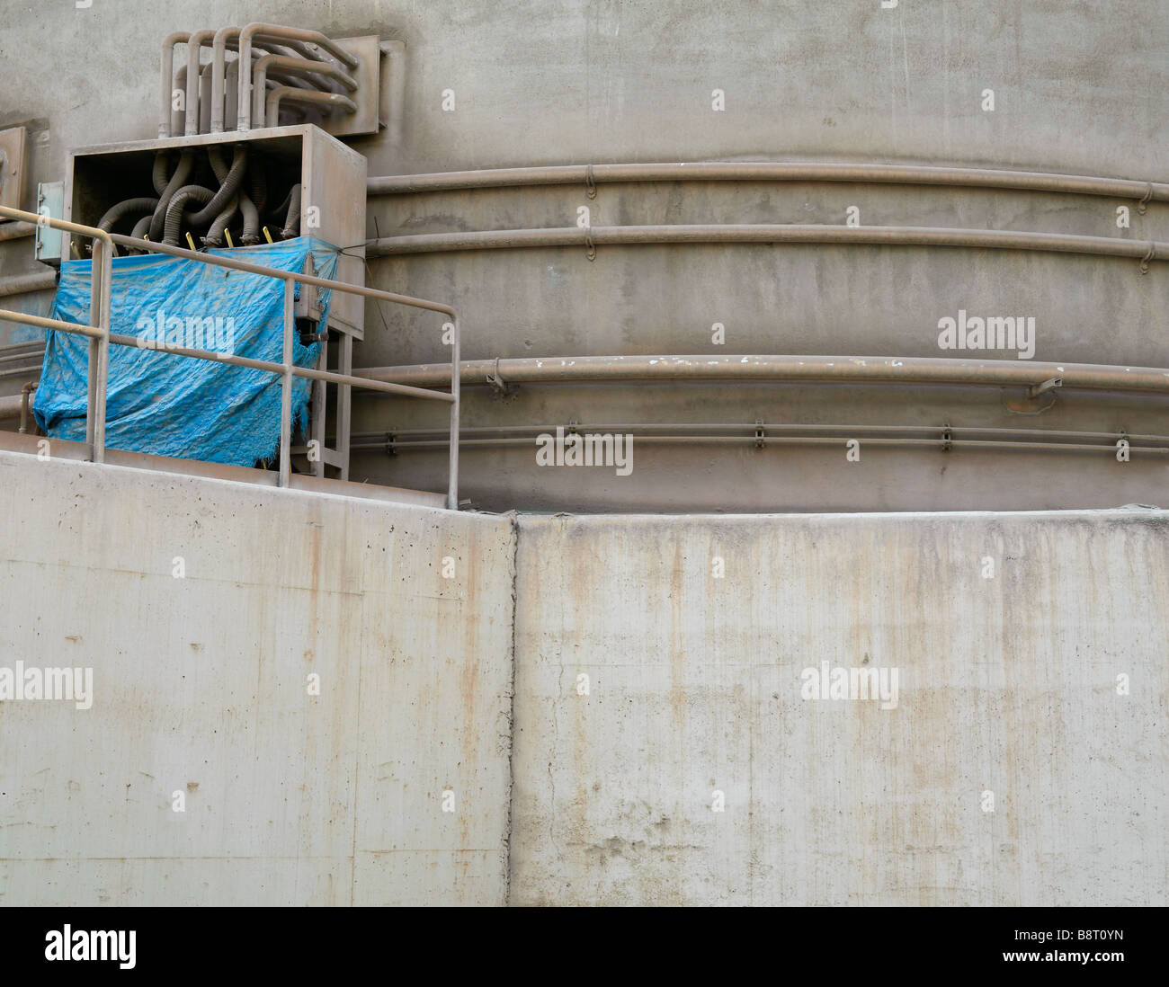 blue tarp on cement silo Stock Photo - Alamy