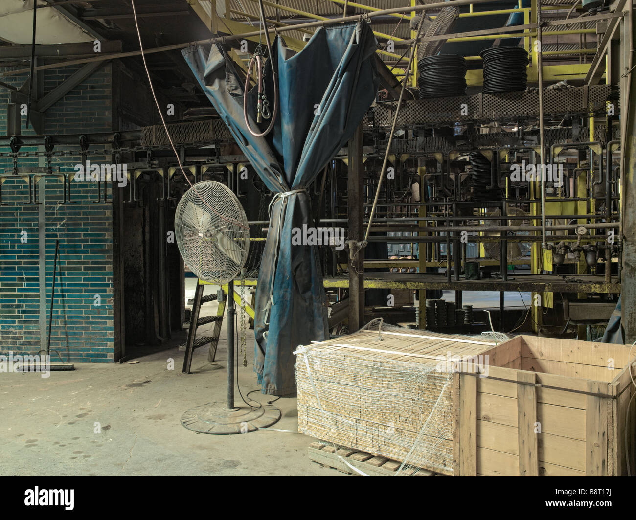 old factory with blue screen and large fan Stock Photo - Alamy