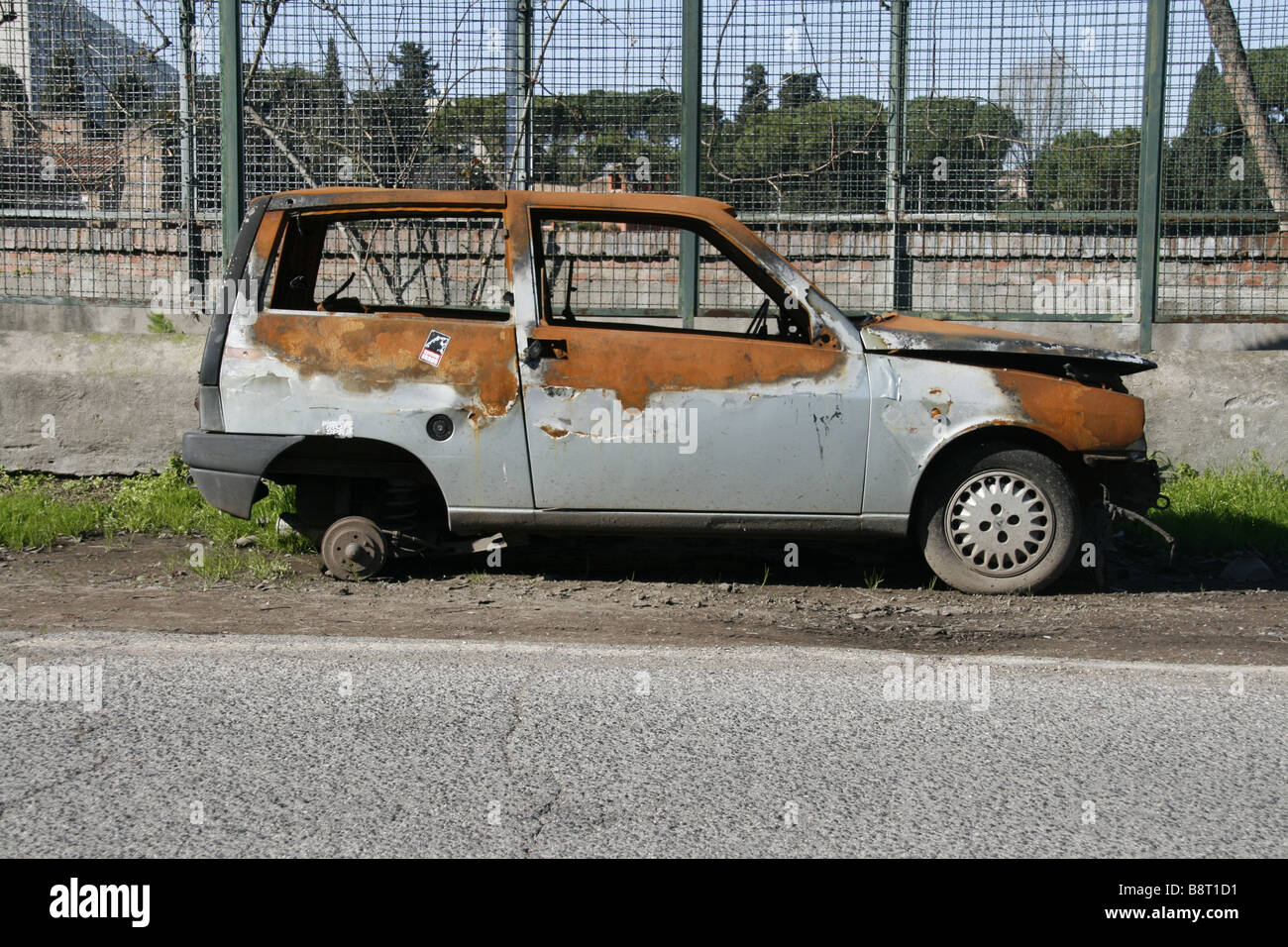 one old car destroyed by fire on street road outdoors Stock Photo - Alamy