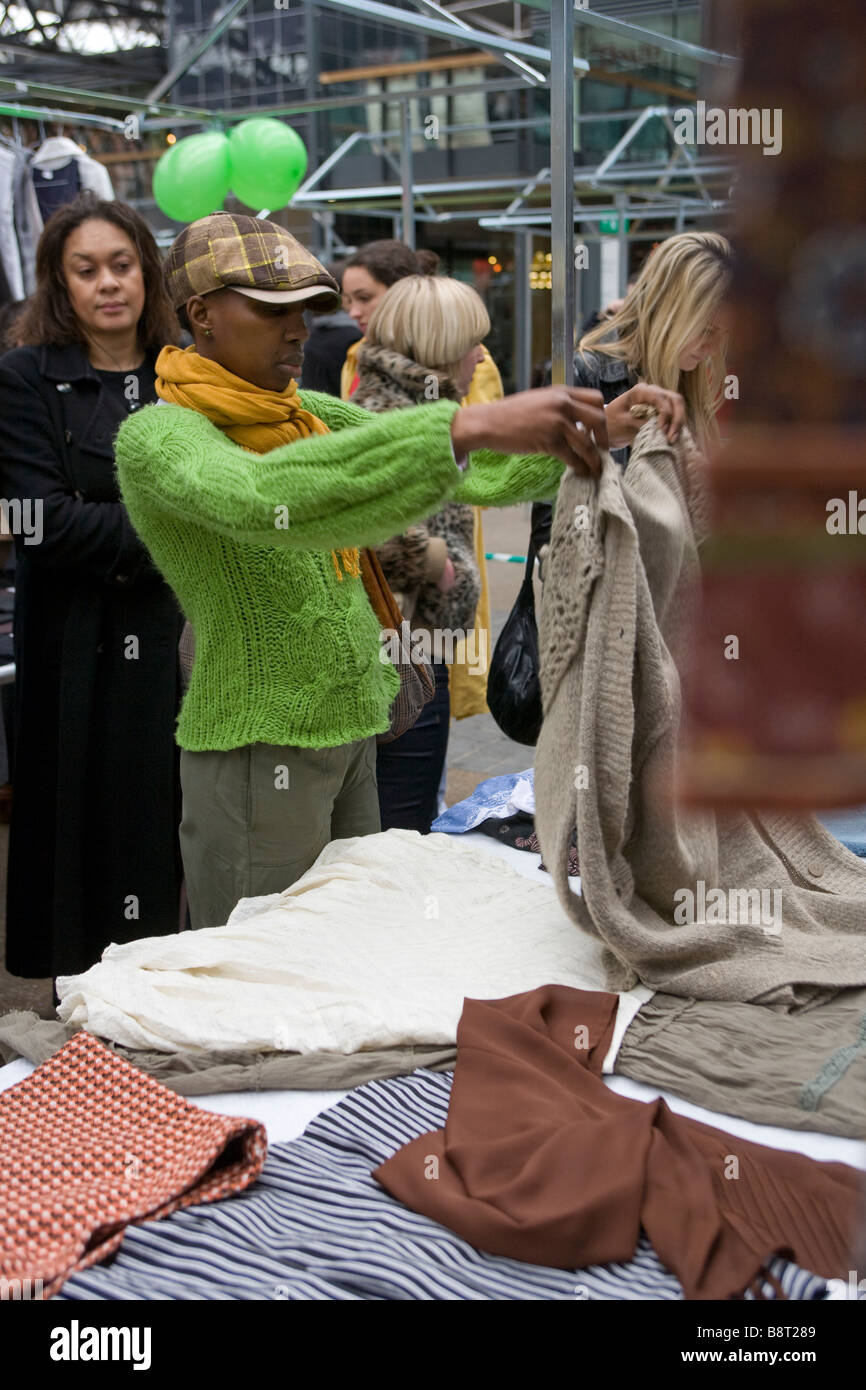 Clothes swapping event in London,Spitalfields Market.People swap their ...