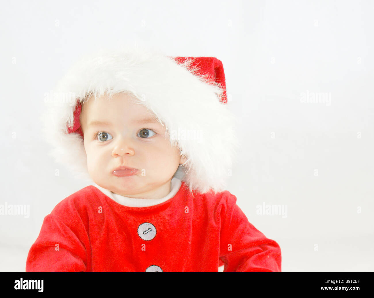 Little boy not happy at playing santa Stock Photo - Alamy