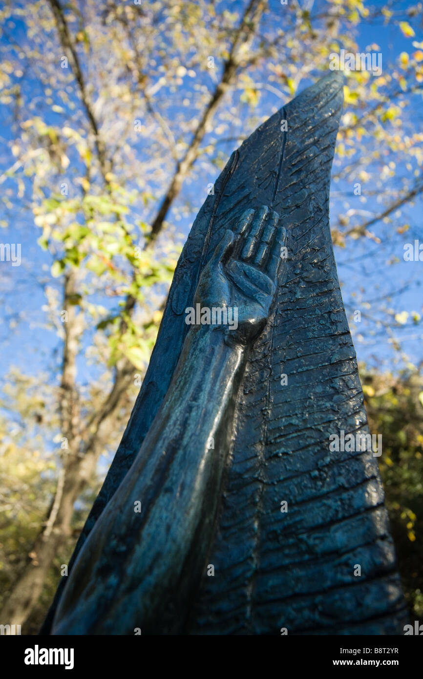 A closeup of a statue in the Umlauf Sculpture garden depicting a winged ...
