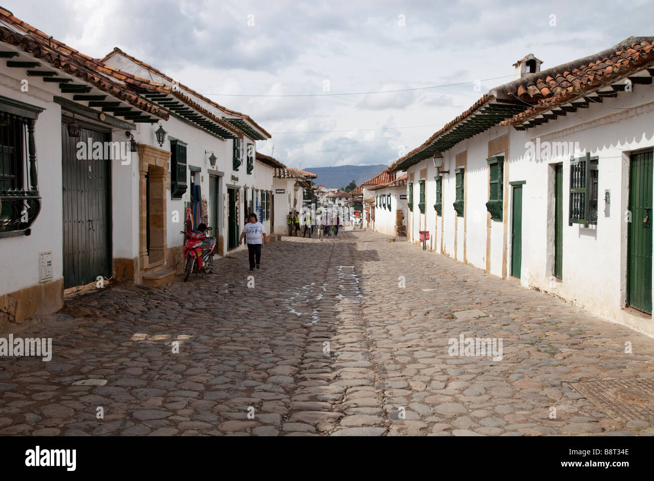 View of cobblestoned street in historic colonial Colombian town of ...