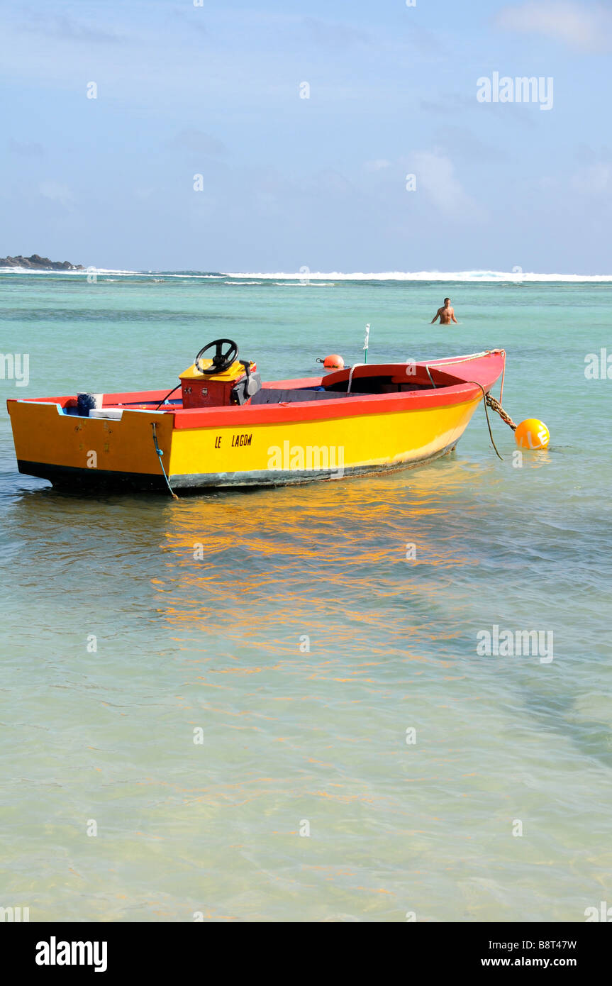 Small Boat in Caribbean Colours Stock Photo - Alamy