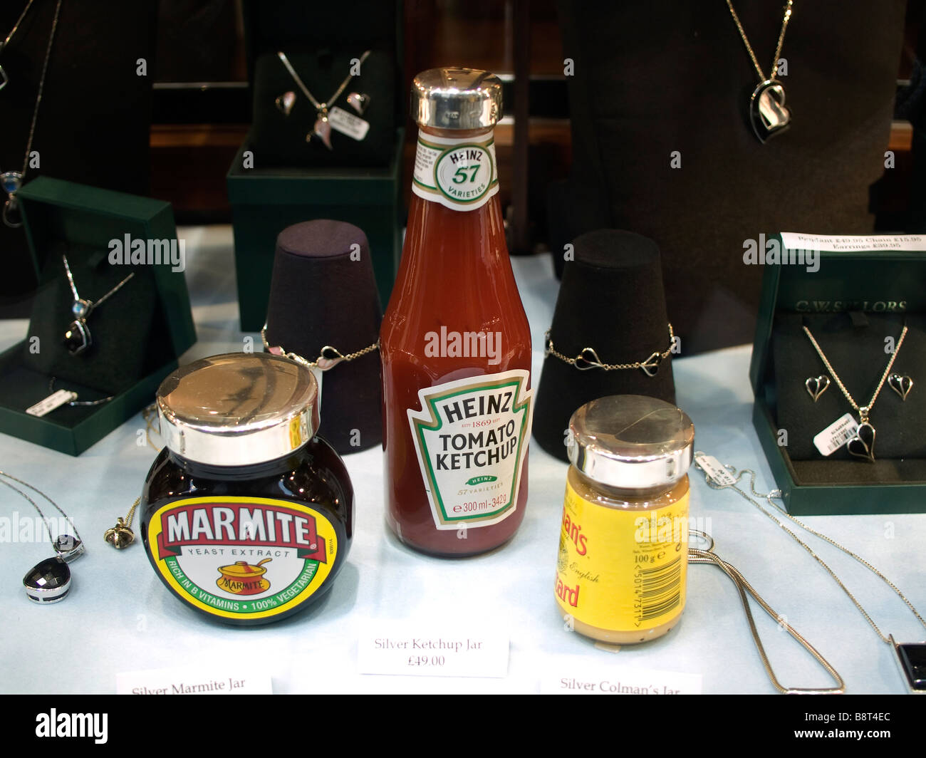 Display in a jewelers shop window of sauce marmite and mustard jars ...