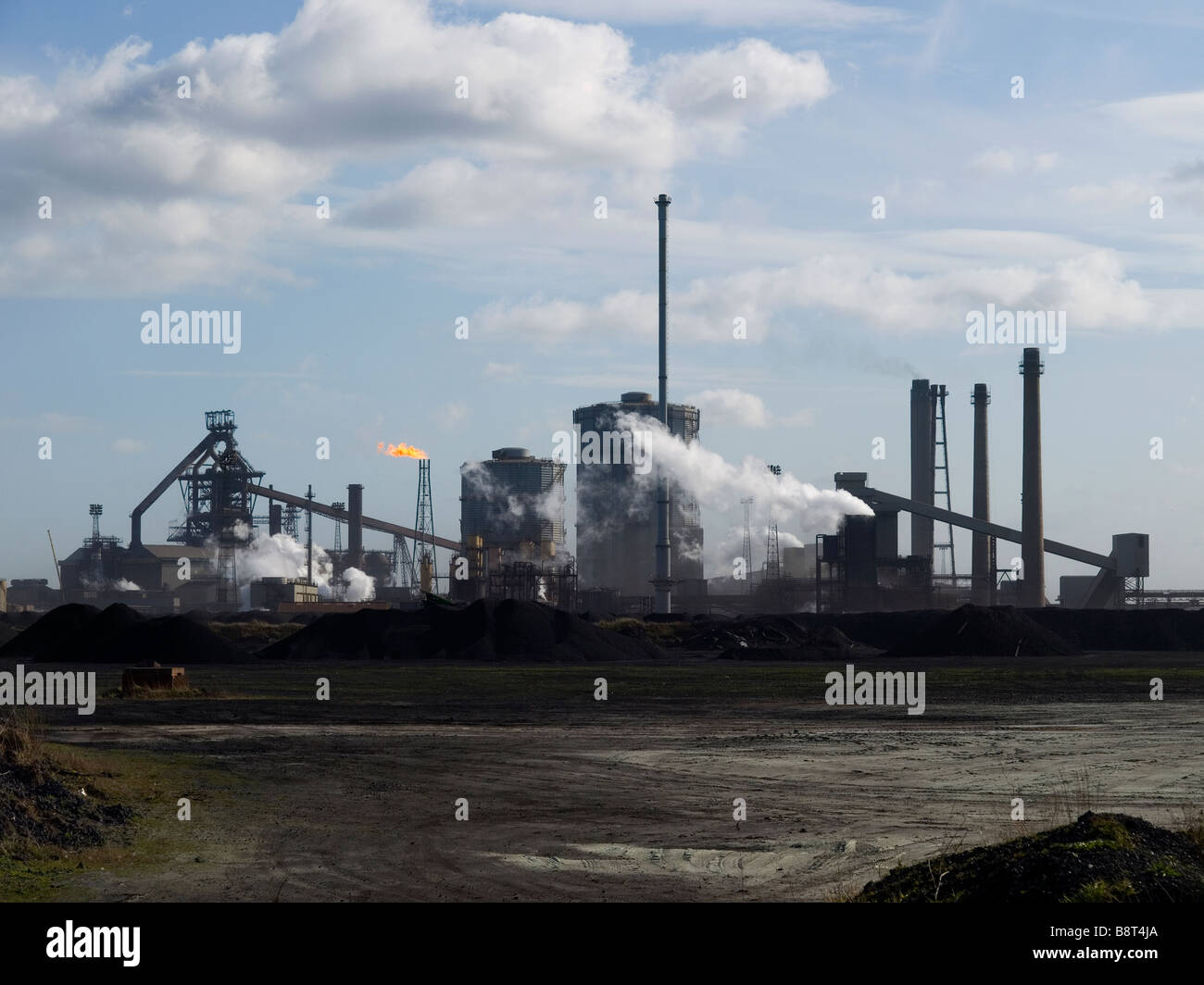 Clouds of steam and flare stack at Redcar steel works Stock Photo - Alamy