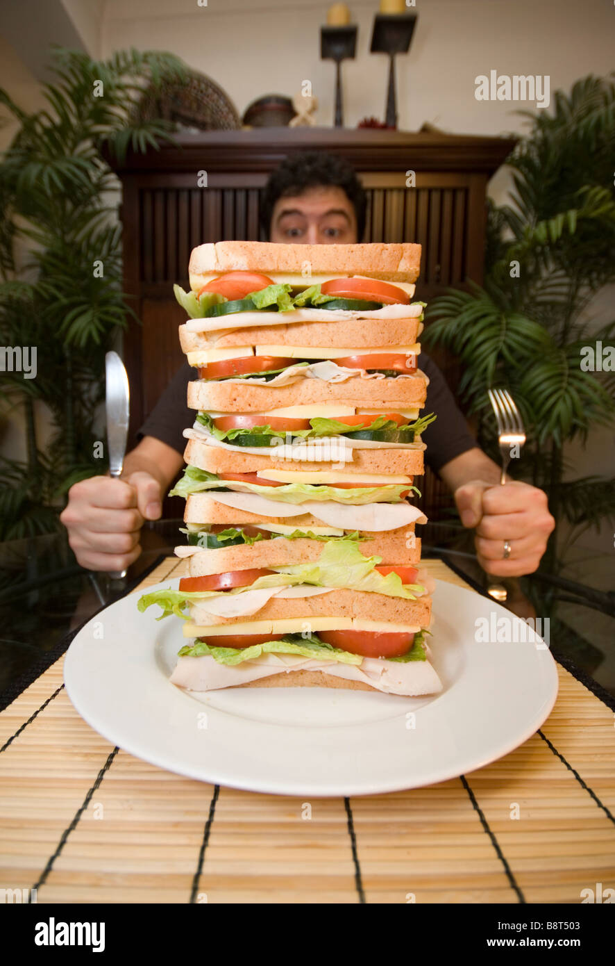 Man and giant sandwich Stock Photo - Alamy