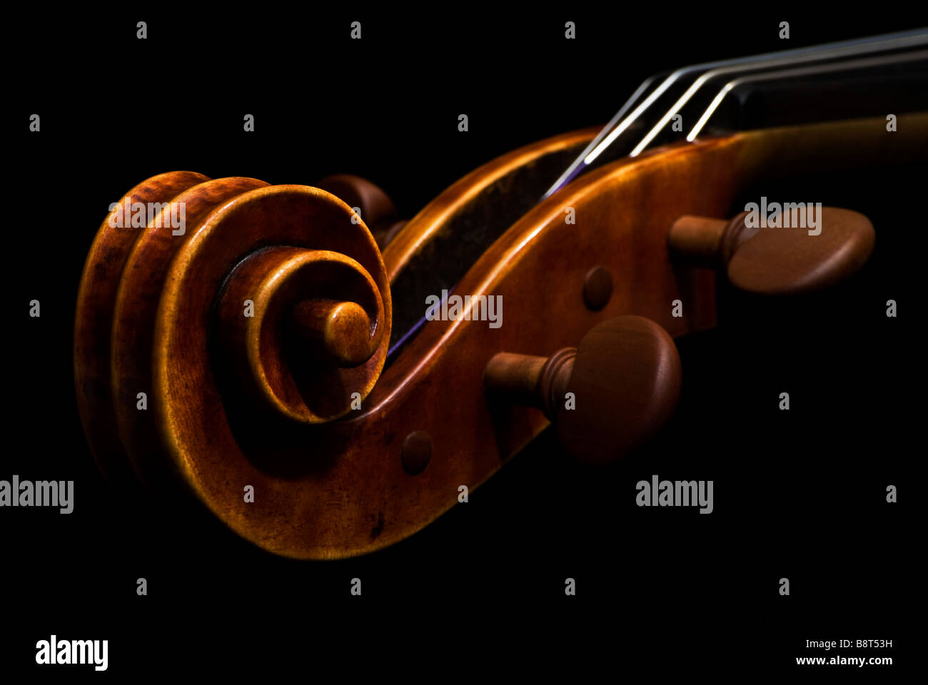 The scroll of a fine violin or viola Stock Photo - Alamy