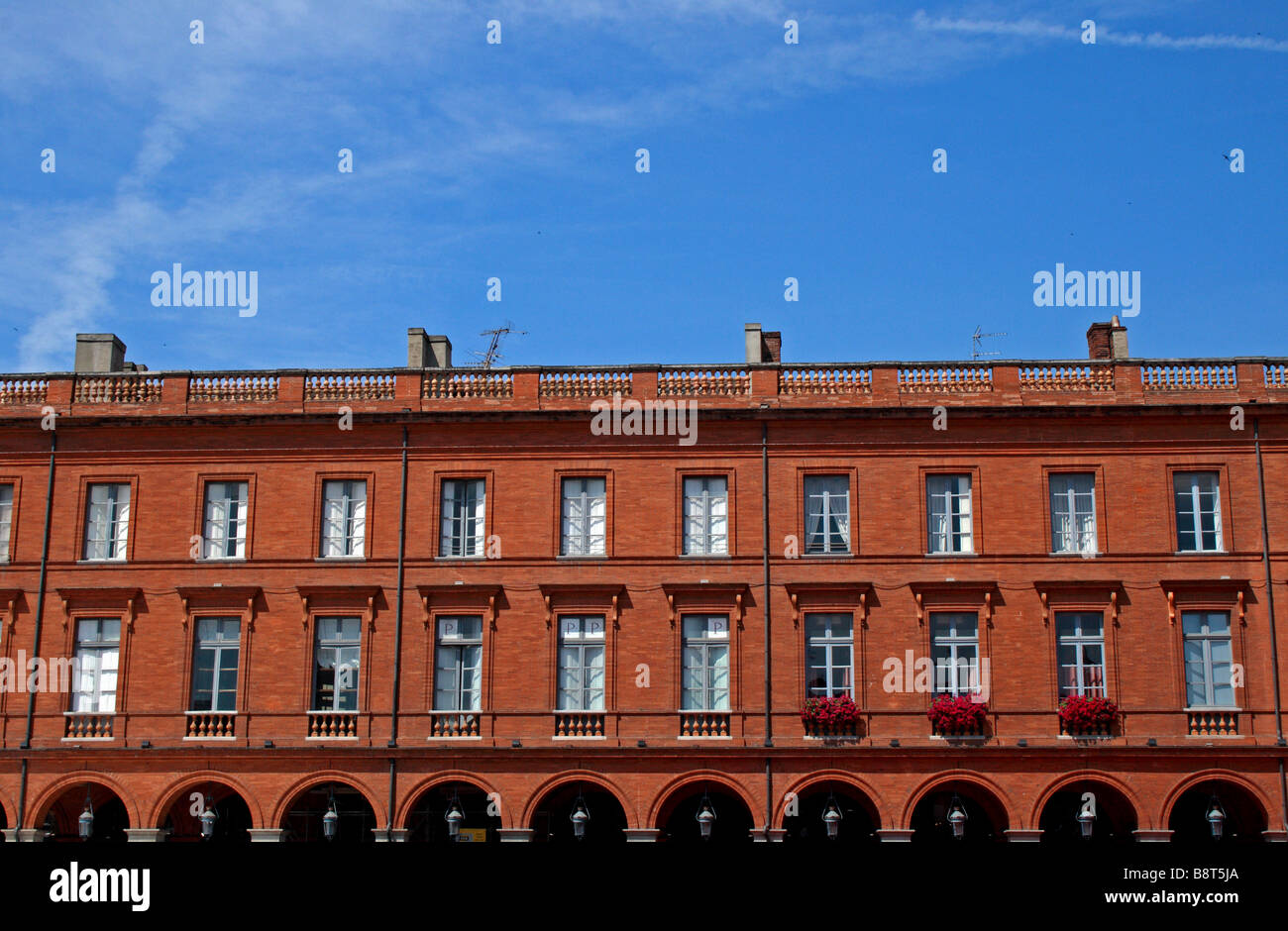 The pink brick buildings surrounding Place du Capitole in Toulouse, in ...