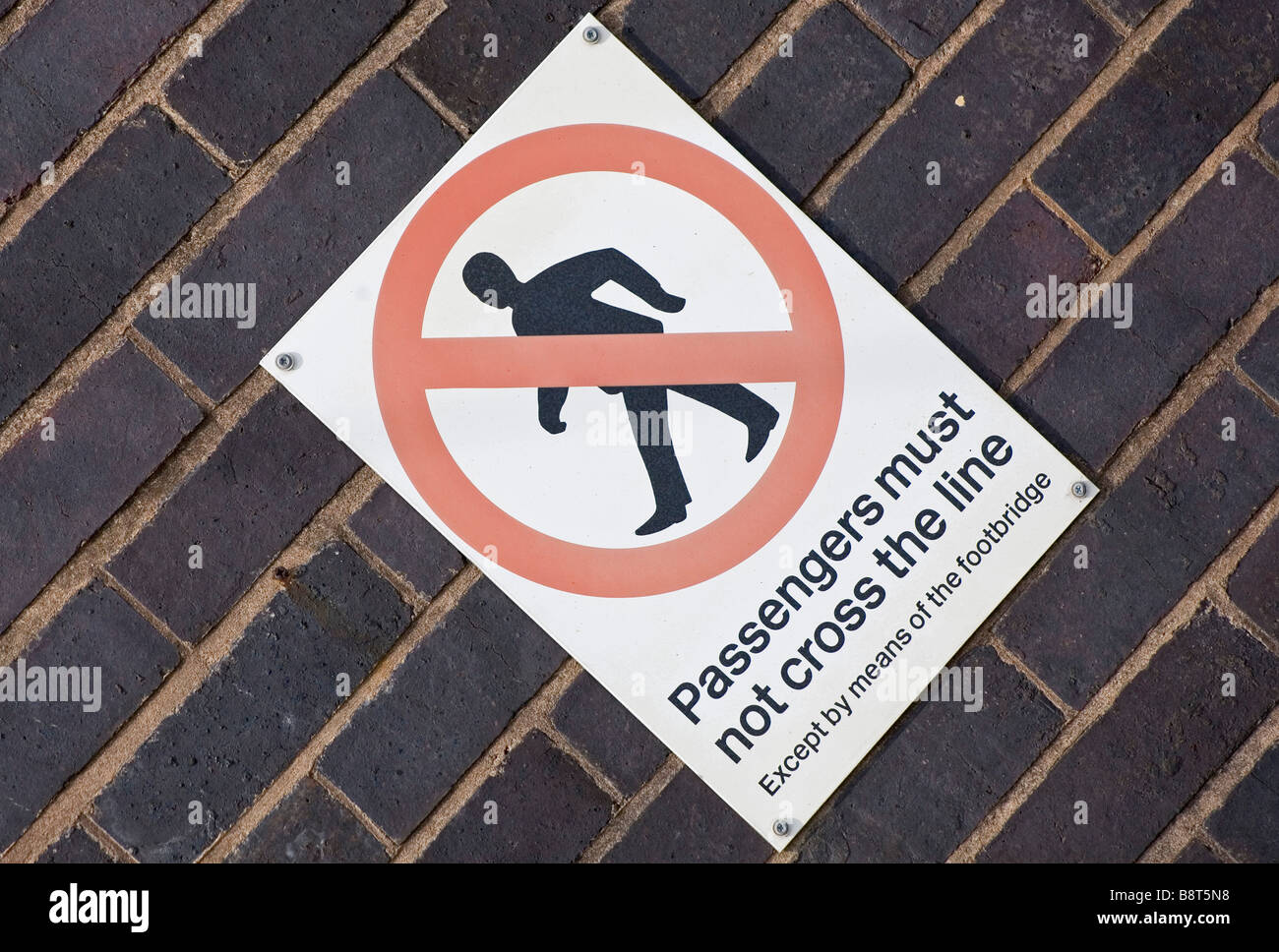 Warning rail passengers cross hi-res stock photography and images - Alamy