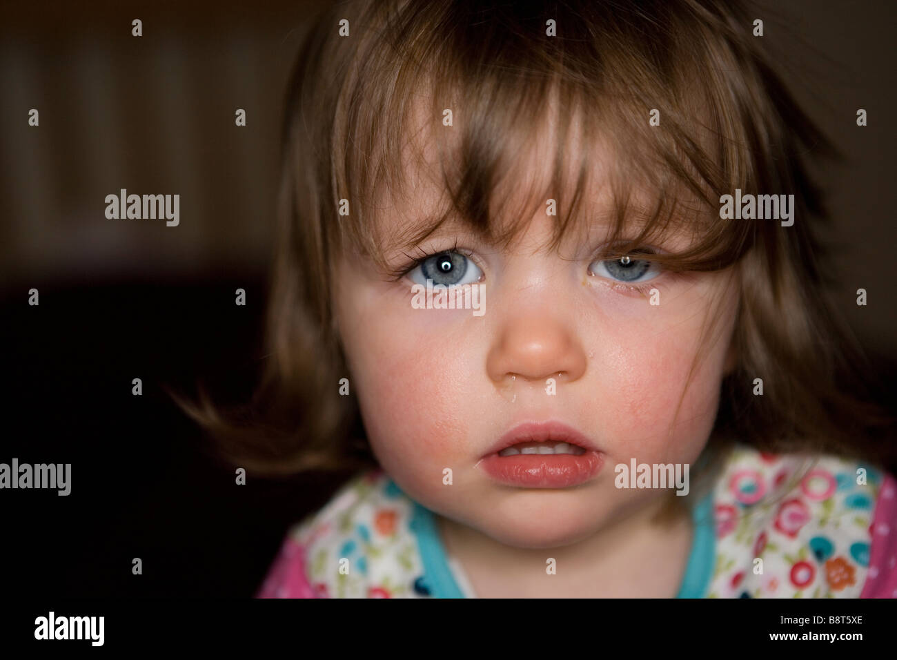 Unhappy looking baby girl up hi-res stock photography and images - Alamy