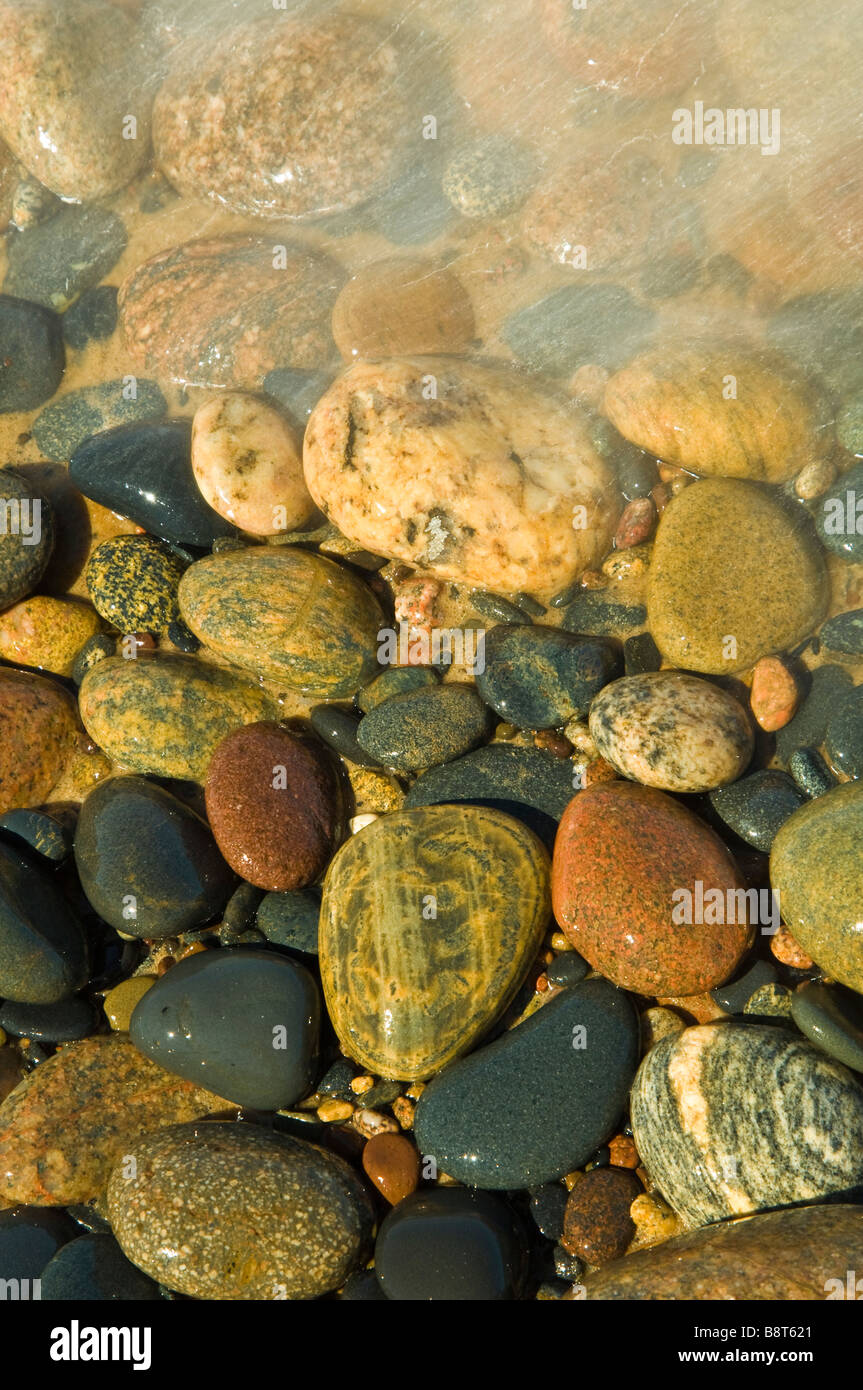 Colorful beach rocks on a Great Lakes shoreline in Northern Michigan ...
