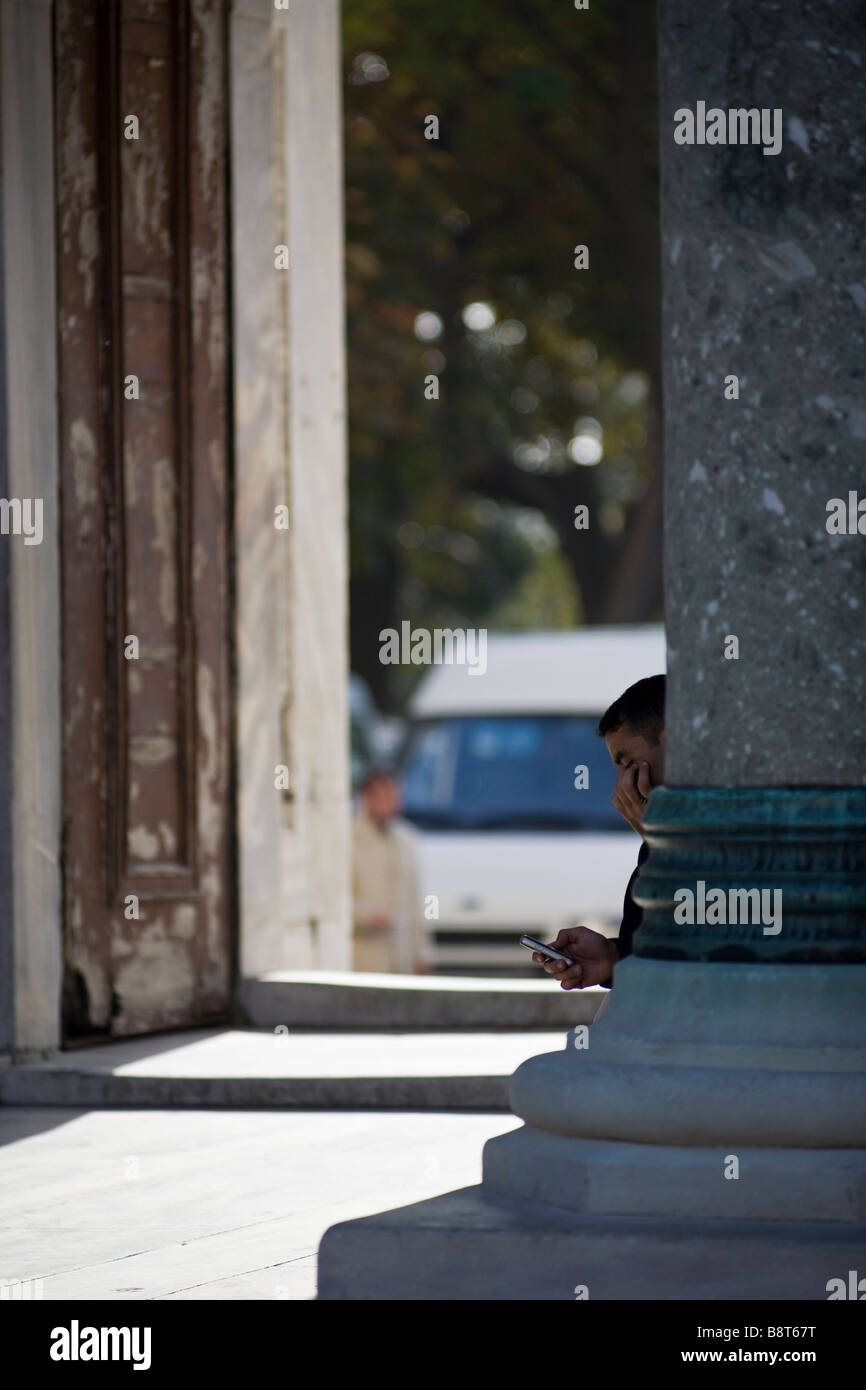 A turkish man using a cell phone inside Beyazit Mosque in Istanbul ...