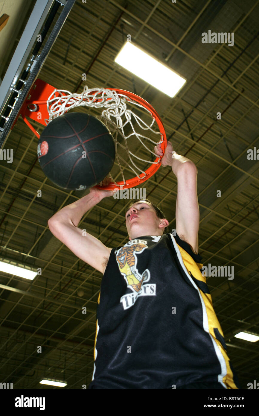 Male dunking basketball in hoop Stock Photo - Alamy