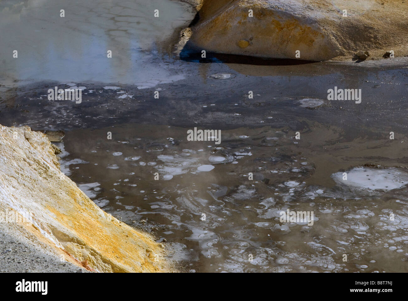 pyrite cristals on surface of Pyrite Pool boiling spring in Bumpass ...