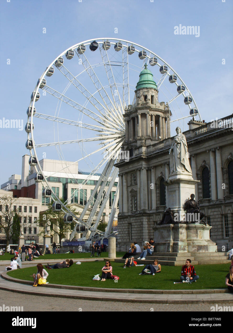 Belfast town hall and eye wheel Stock Photo - Alamy