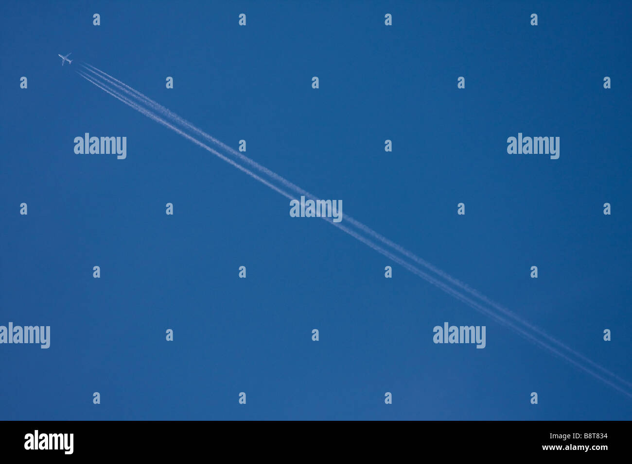 Airplane marks the blue sky Stock Photo - Alamy