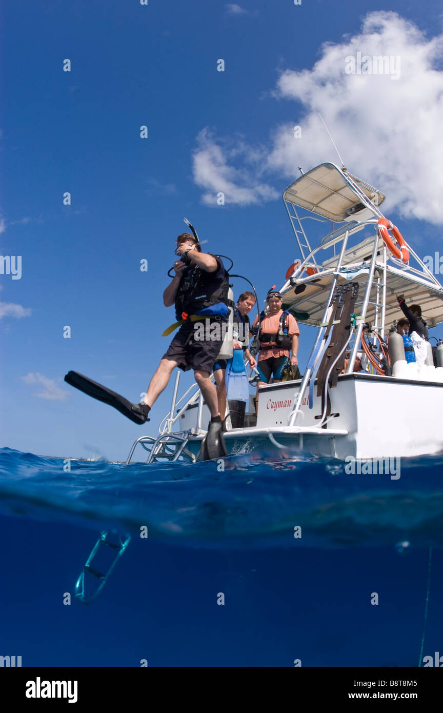 Giant-stride dive entry off a diveboat Stock Photo - Alamy