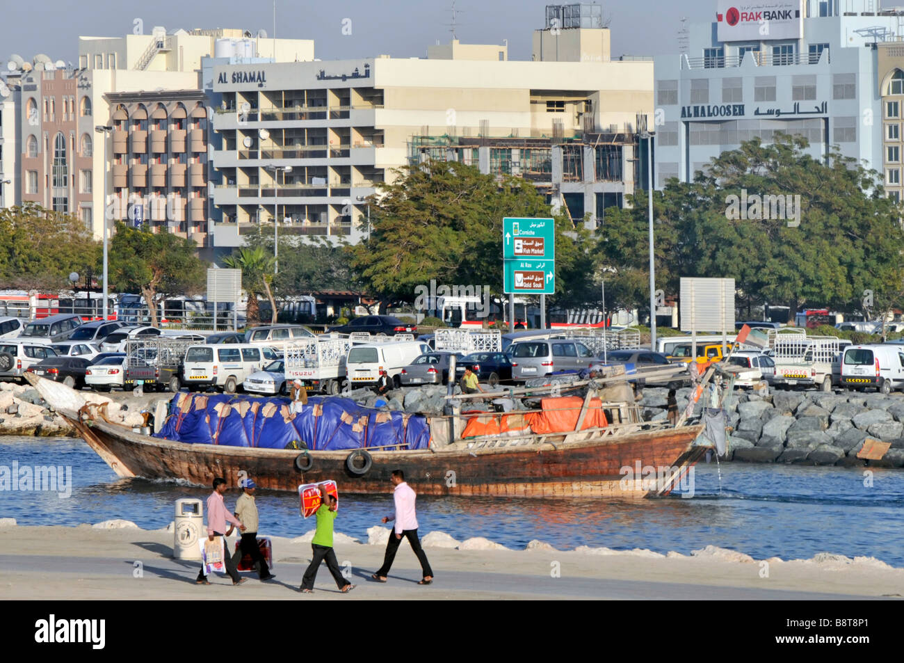 Worker carrying fully loaded hi-res stock photography and images - Alamy