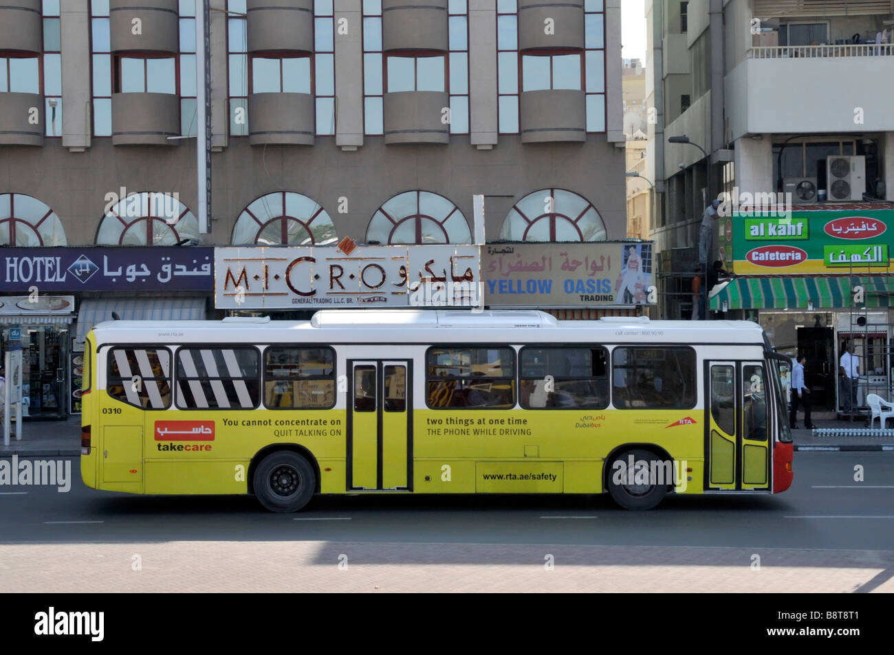 Dubai shopping street scene single decker public transport bus by Road ...