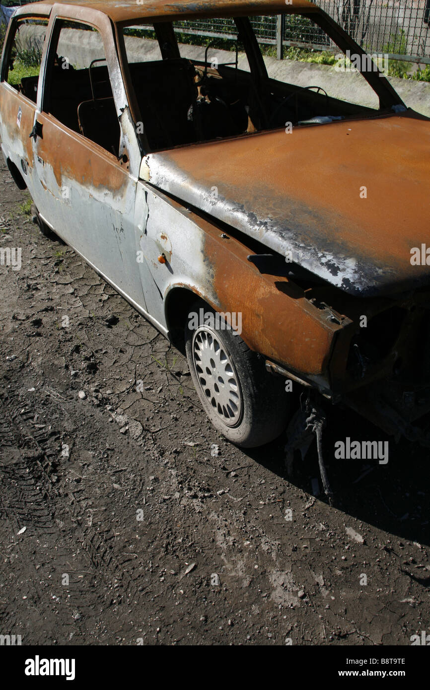 one old car destroyed by fire on street road outdoors Stock Photo - Alamy