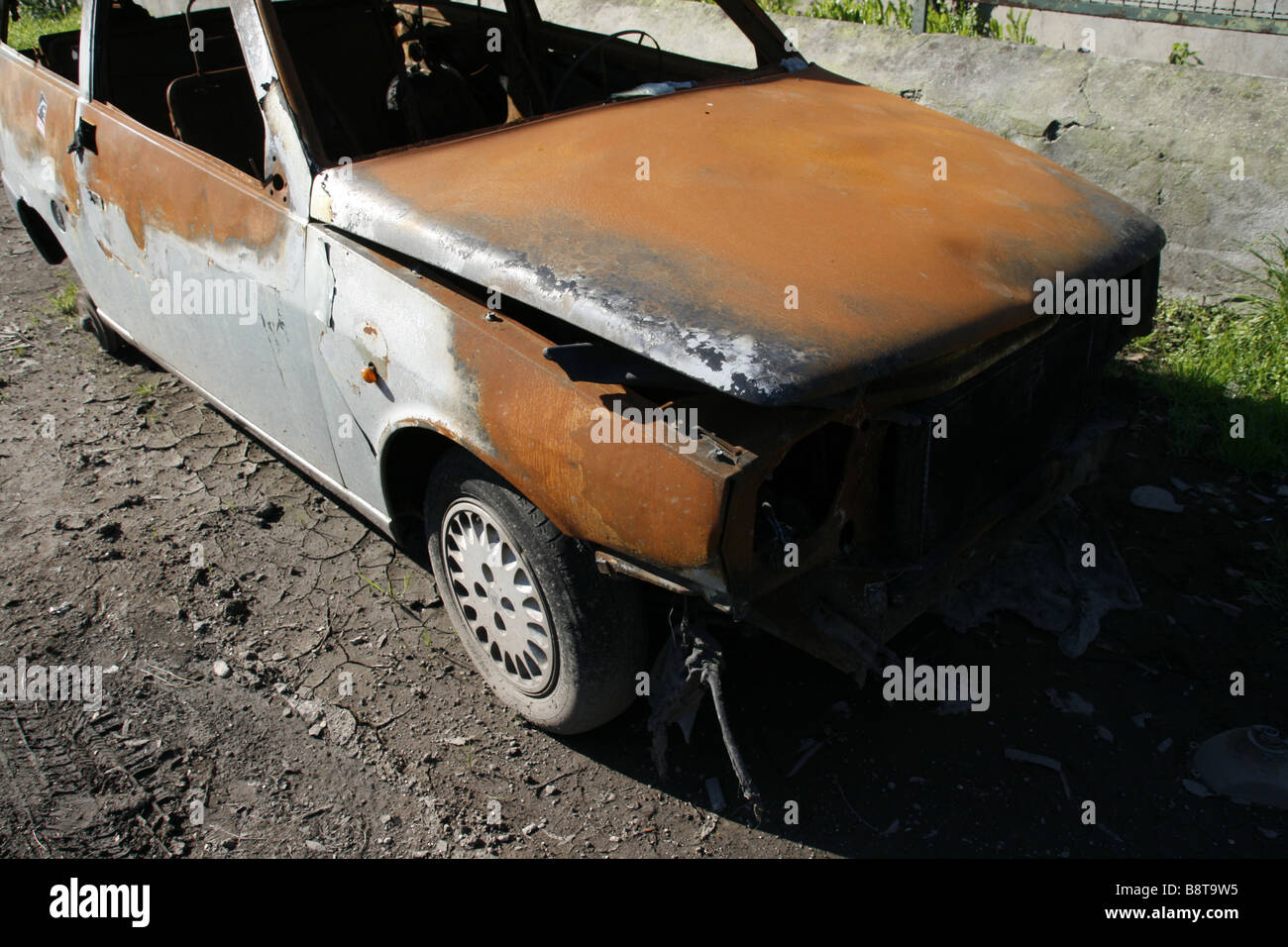 one old car destroyed by fire on street road outdoors Stock Photo - Alamy