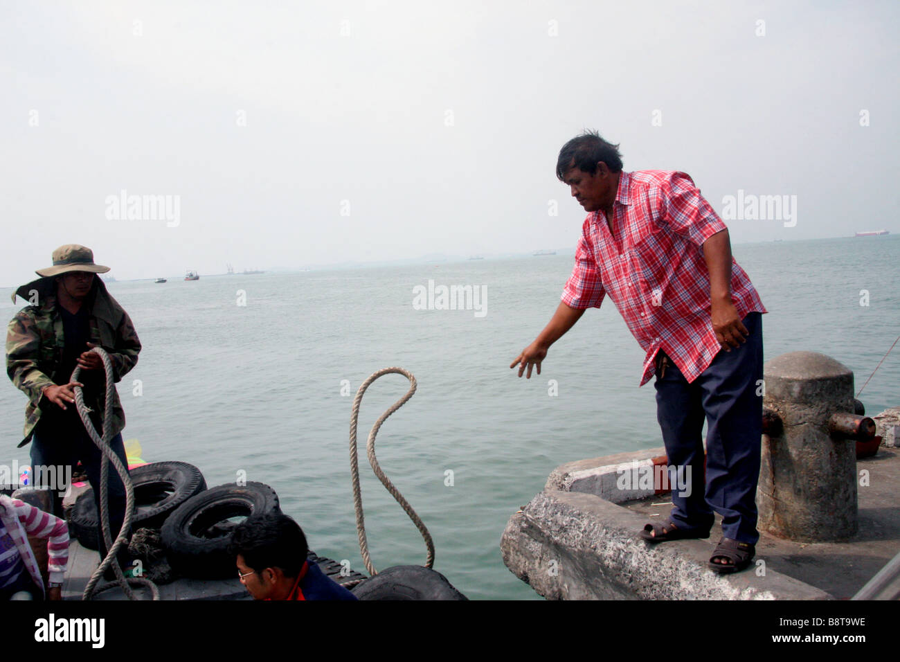 Two fishermen casting off Stock Photo - Alamy