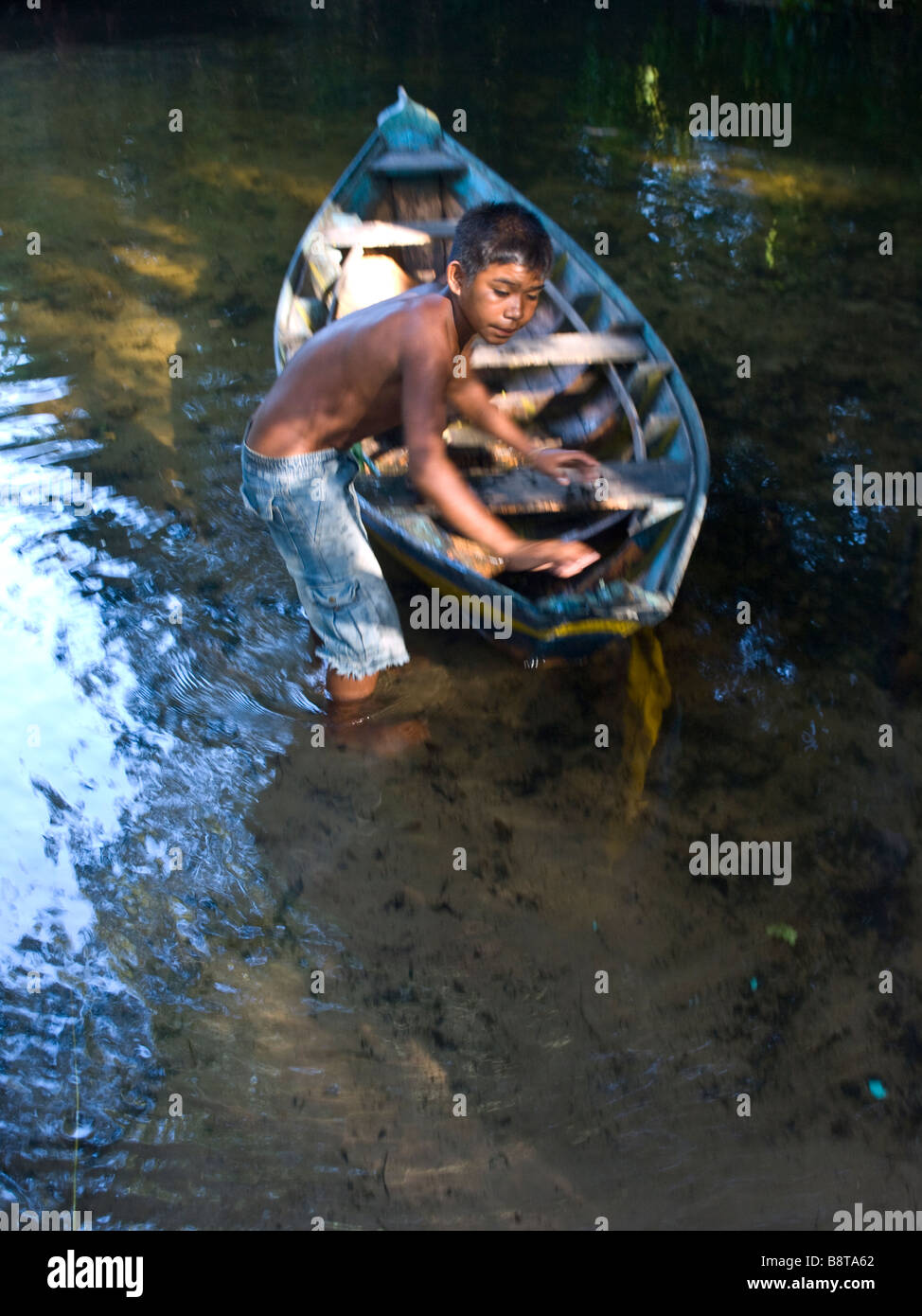 A young amazonian indigenous boy with his boat , Jamaraquá , Tapajos ...