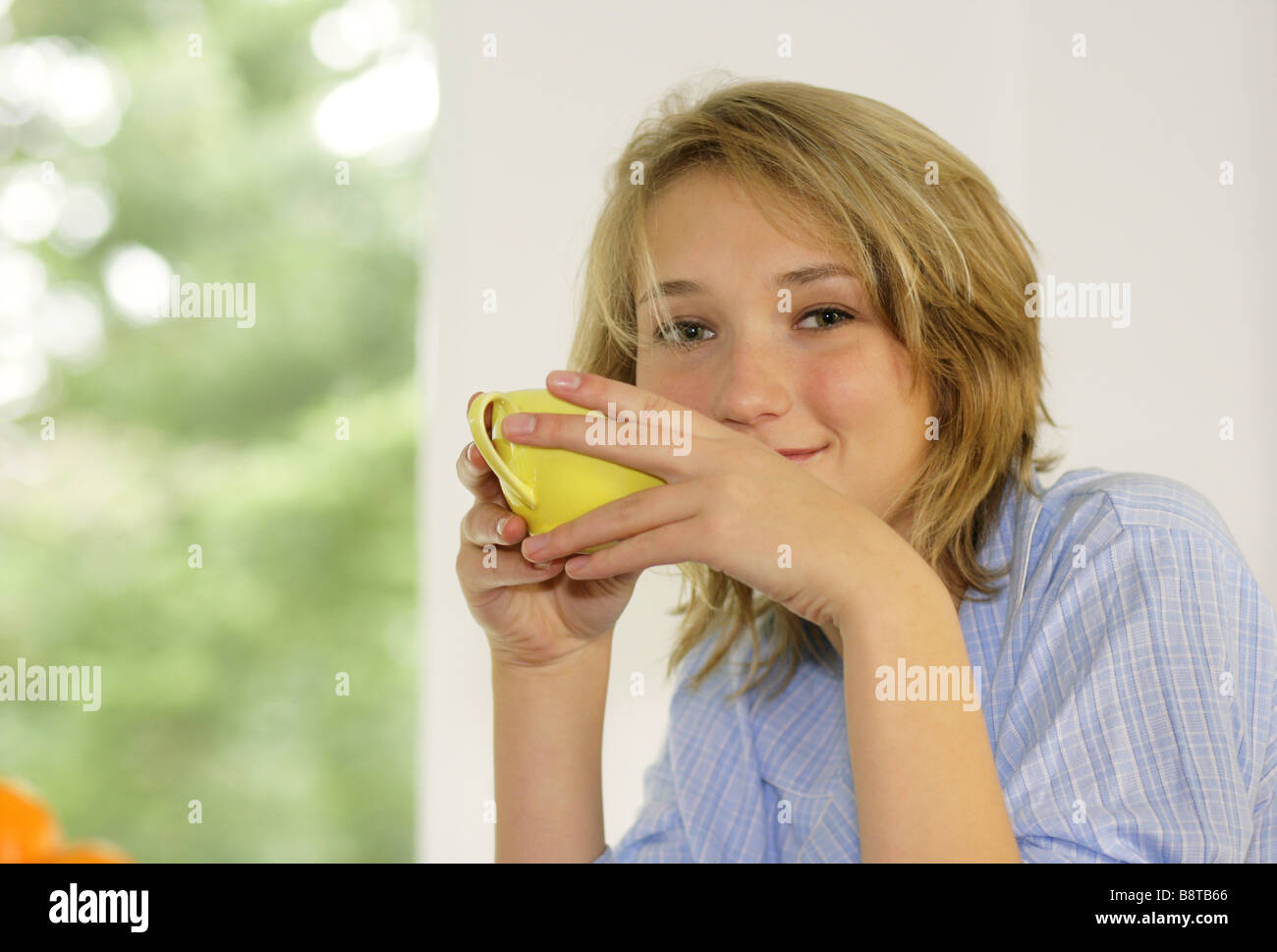 young woman with the first cup of coffee in the morning Stock Photo - Alamy