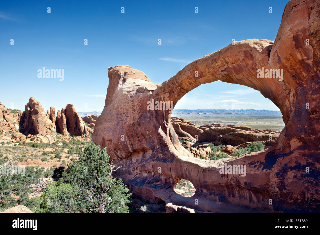 Double arch sunset arches national park hi-res stock photography and ...