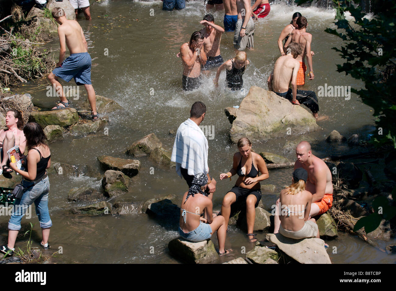 Young people bathing in a stream Stock Photo - Alamy
