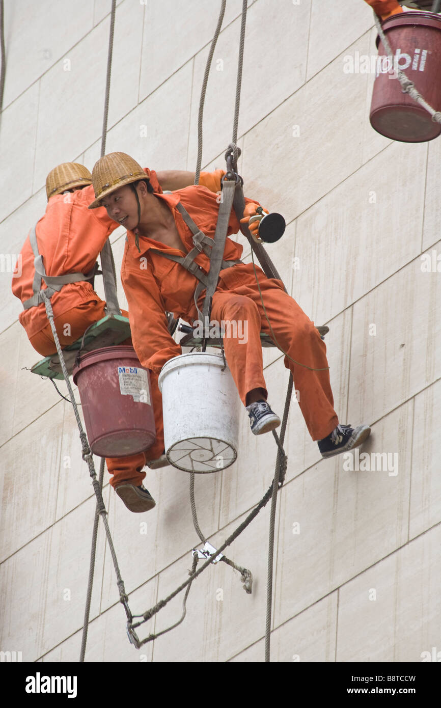 Abseiling skyscraper cleaners on a tower in Beijing, China Stock Photo ...