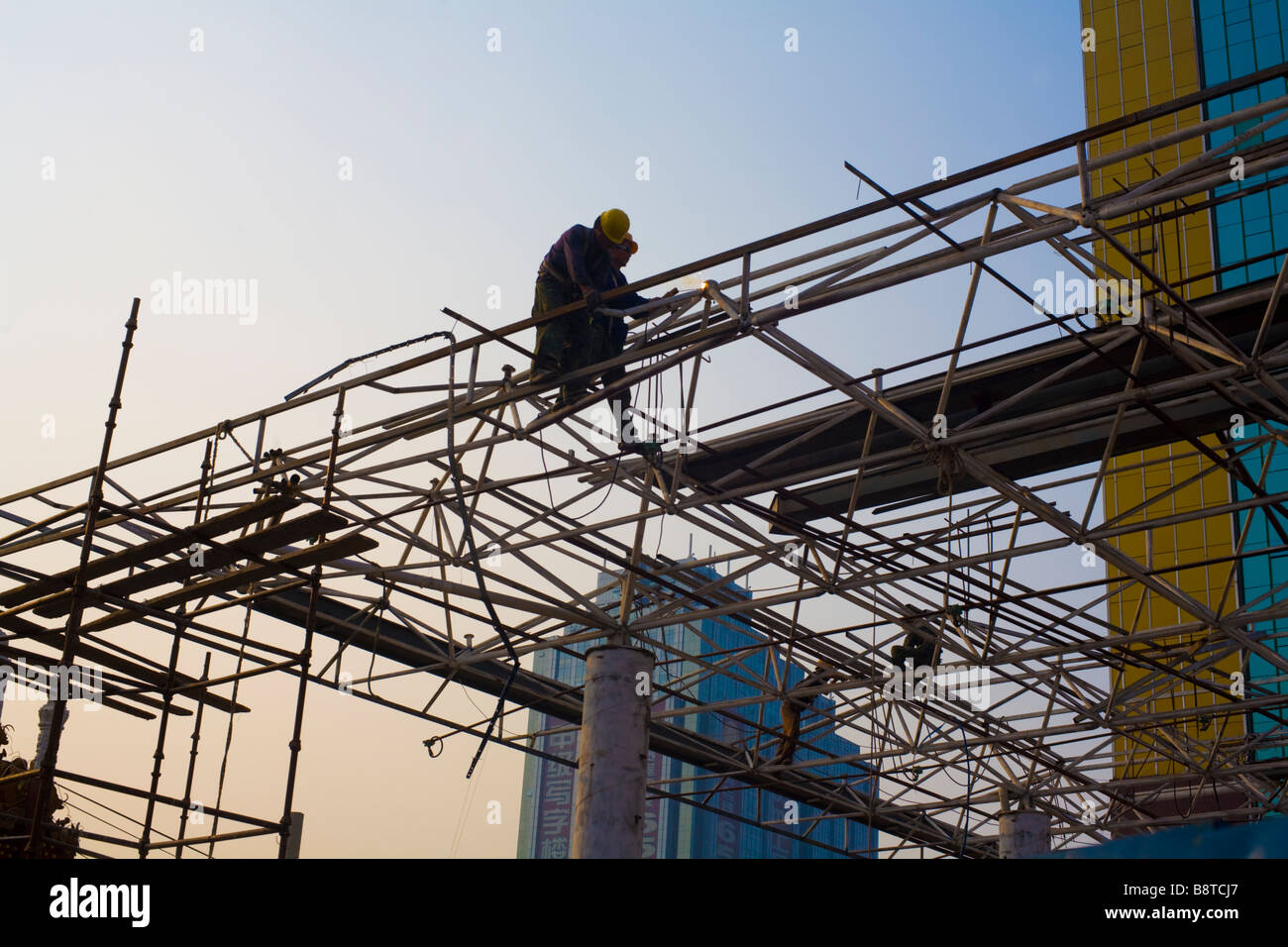 Construction workers welding a scaffolding in Beijing, China Stock ...