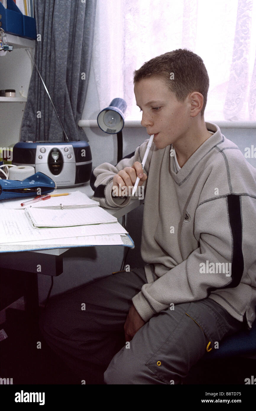 teenage boy doing homework in his bedroom Stock Photo - Alamy
