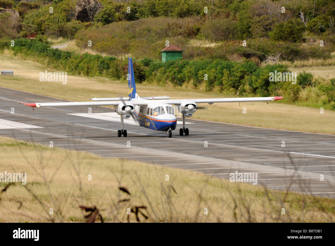 Airplane landing at St Barths airport Stock Photo - Alamy