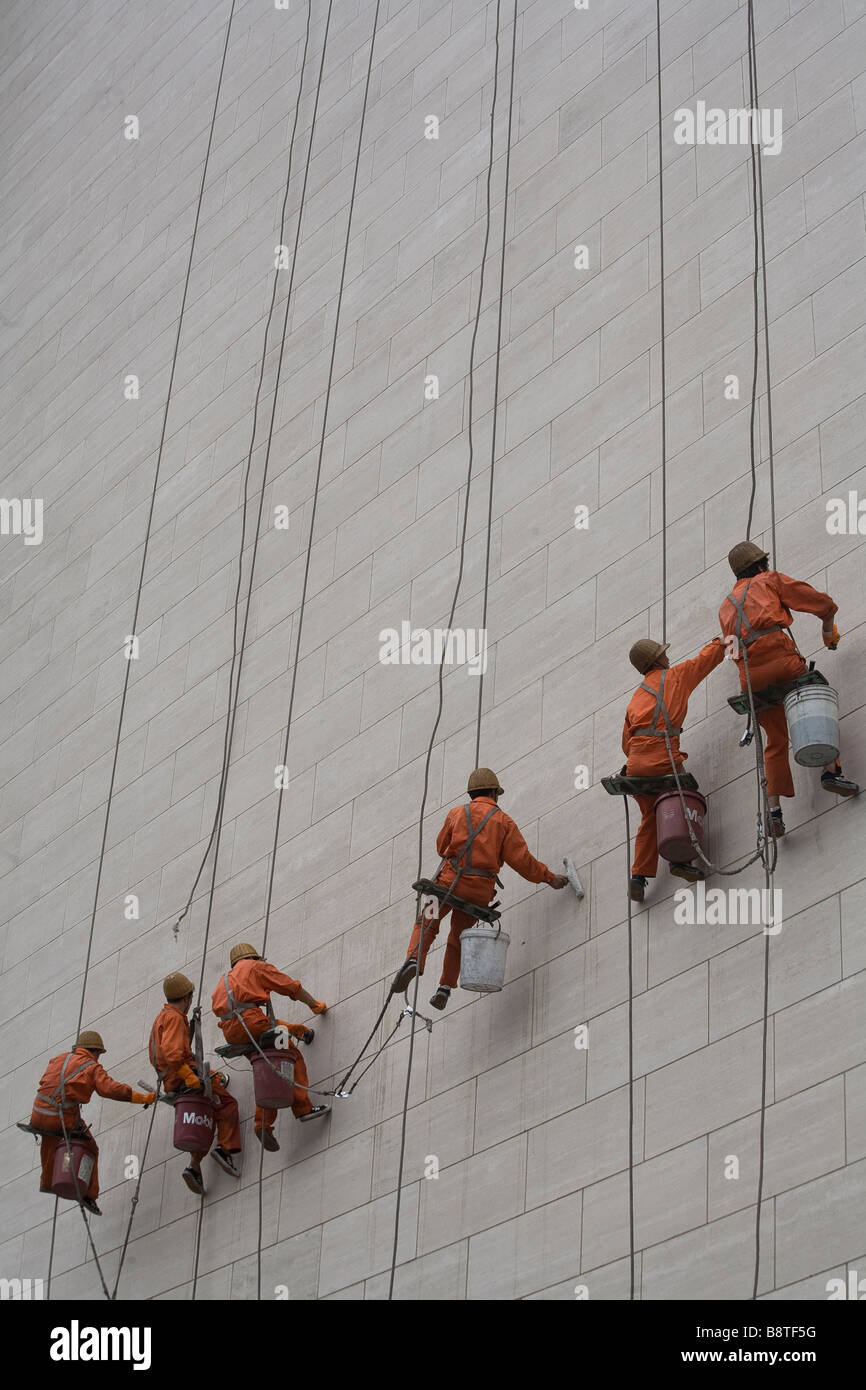 Abseiling skyscraper cleaners on a tower in Beijing, China Stock Photo ...