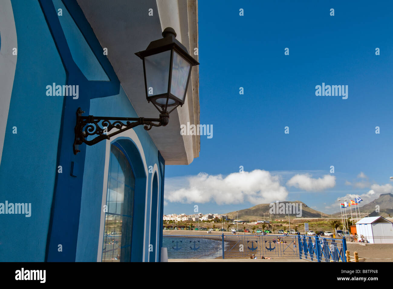 Traditional spanish style lamp on wall of harbour masters house at Las ...