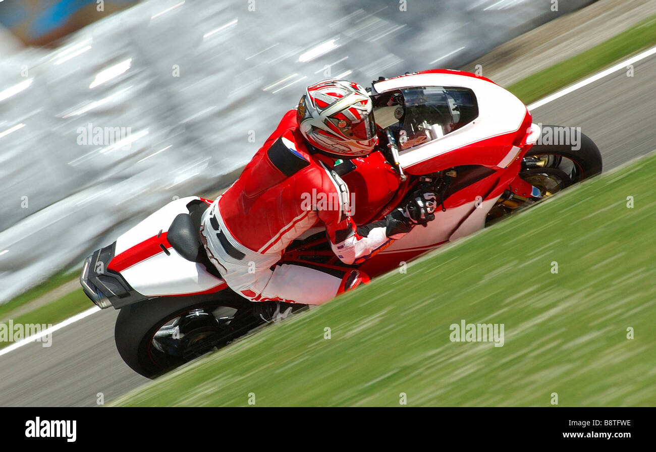 A motorbike racing in circuit visible panning Stock Photo - Alamy