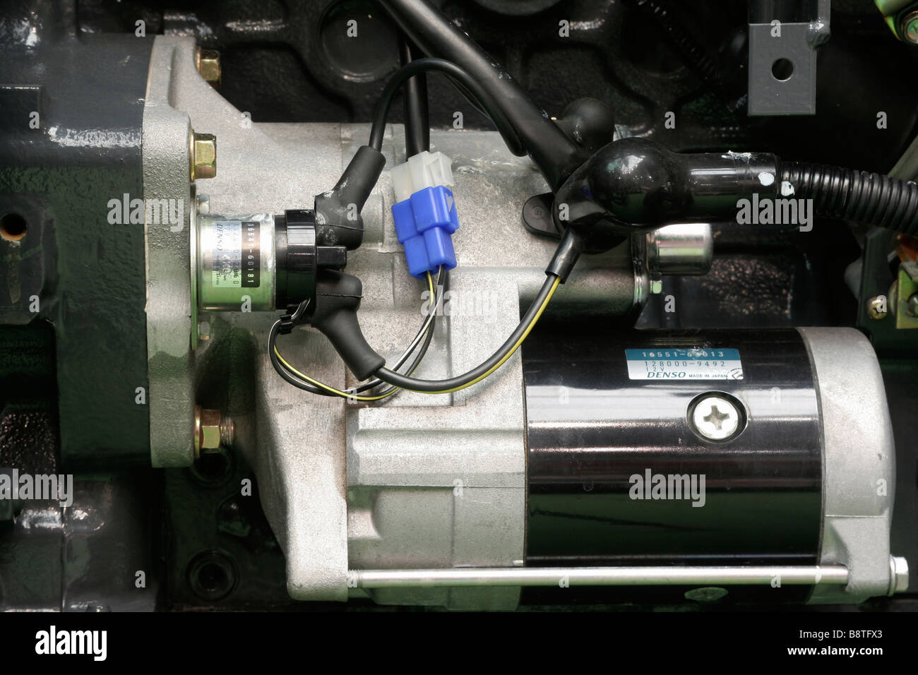 Starter on farm tractor engine Stock Photo - Alamy