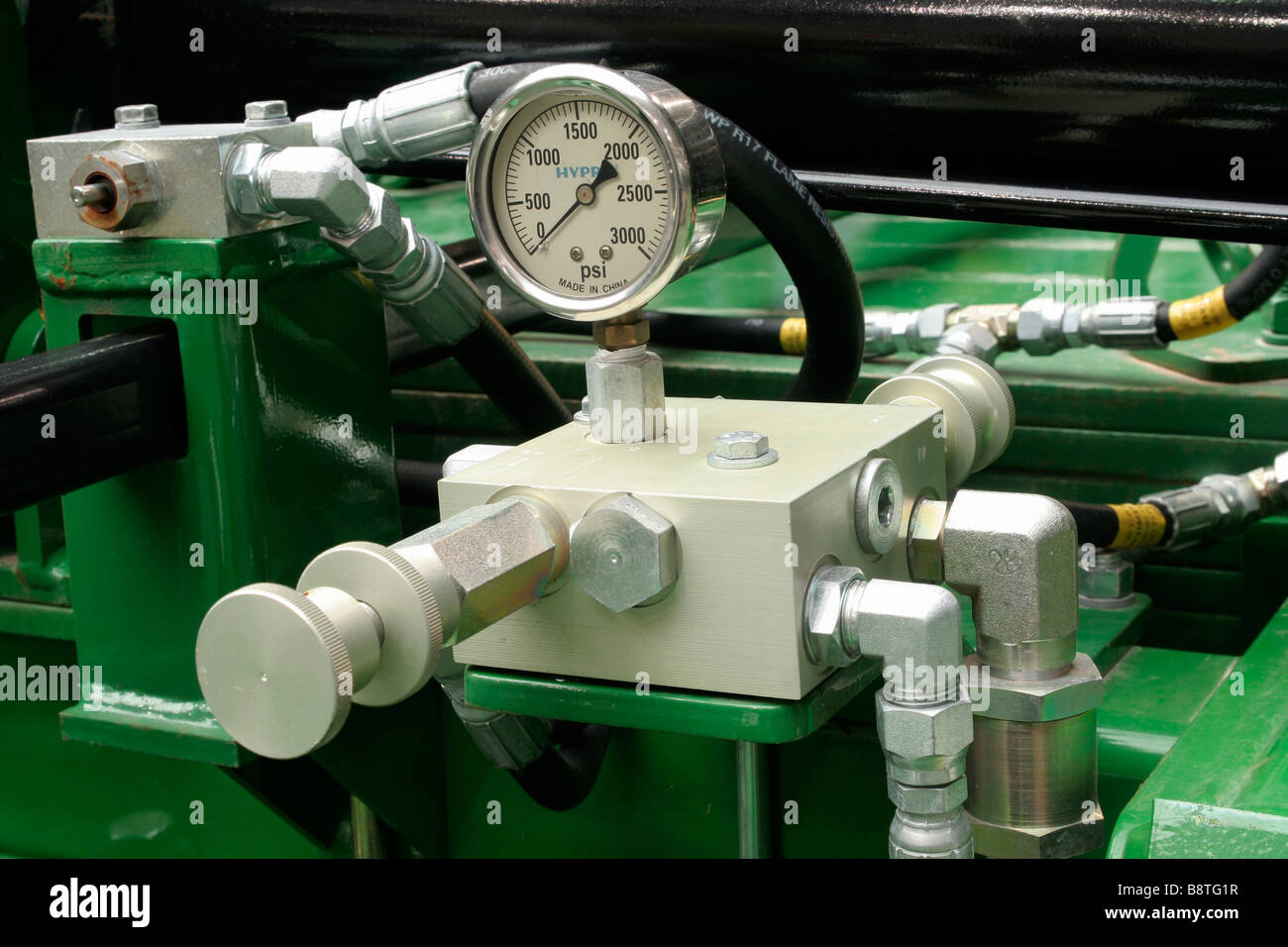 Hydraulic equipment with pressure gauge on farm machine Stock Photo - Alamy