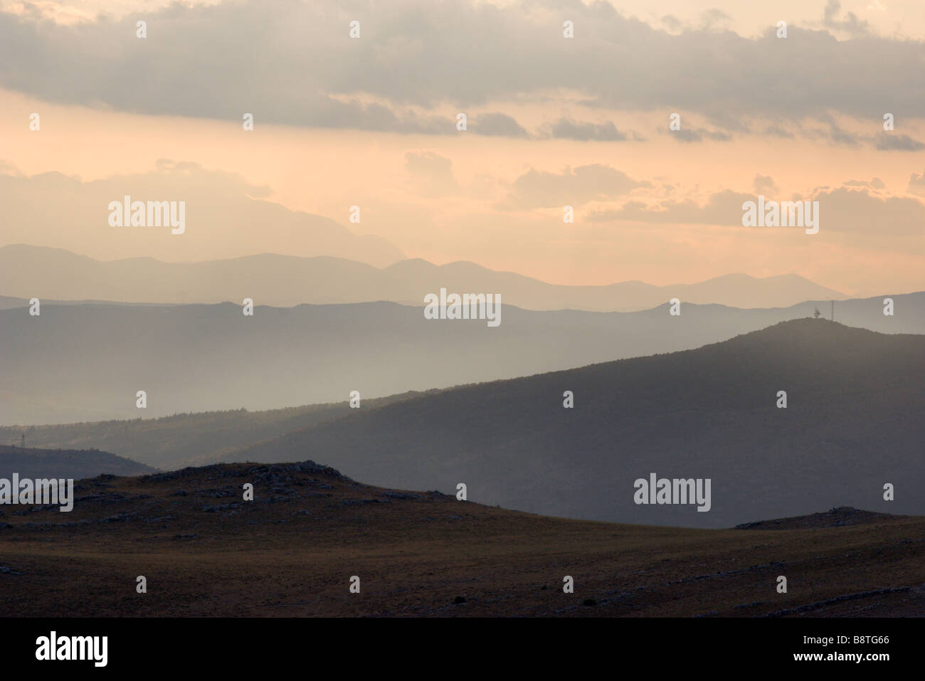 wavy hills and clouds at sunset Stock Photo - Alamy