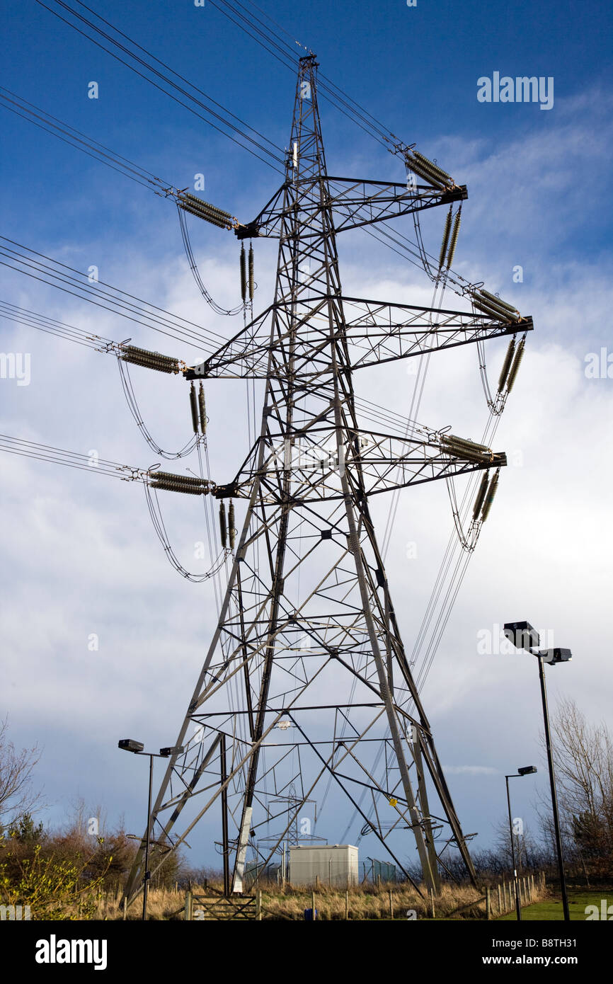 ELECTRICAL POWER PYLON WITH SUPPLY CABLES AGAINST A CLOUDY SKY, Credit ...