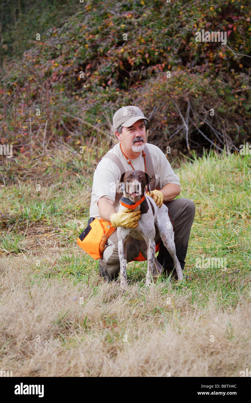 FRONT FULL VIEW HUNTING GUIDE WITH DOG LOOKING INTO DISTANCE GEORGIA ...