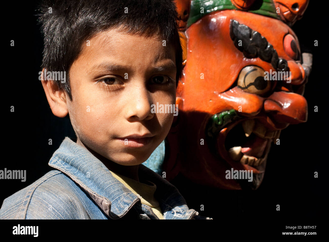 Young Nepali kid and traditional Nepali mask Stock Photo - Alamy