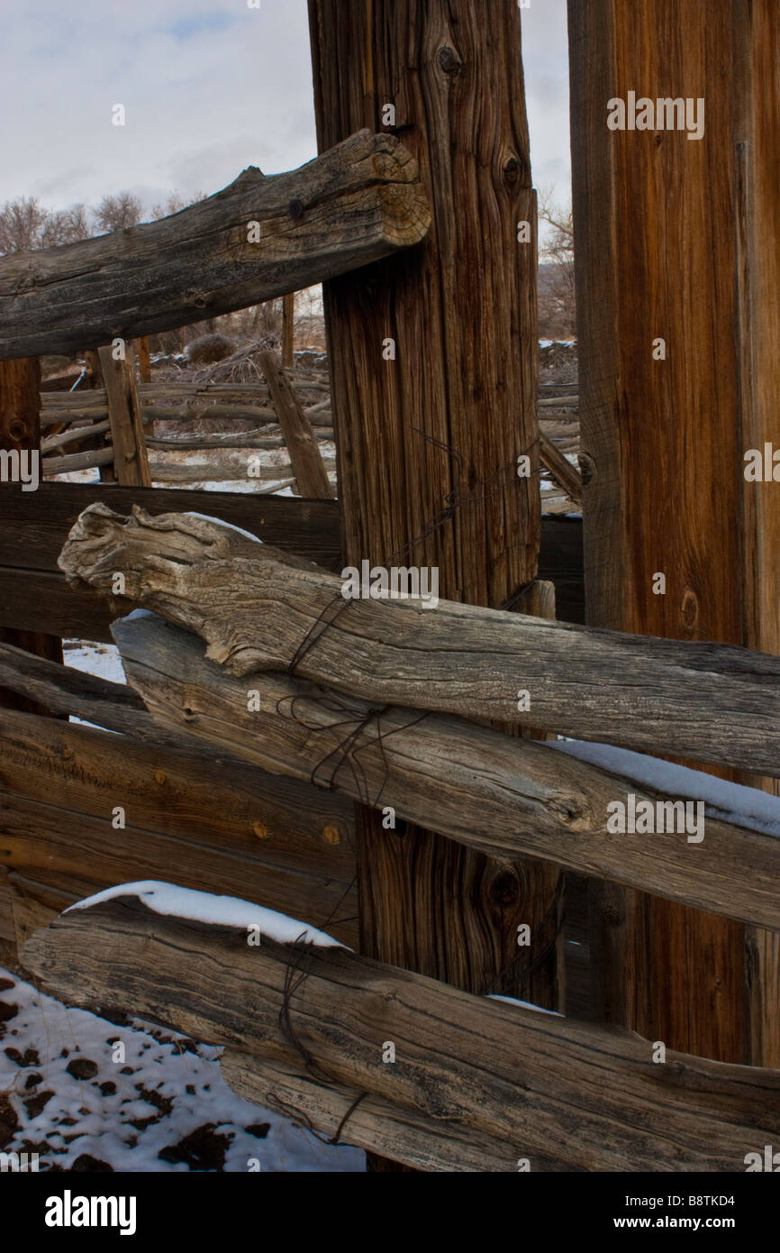 Snow on a weathered fence post of an old corral Stock Photo - Alamy